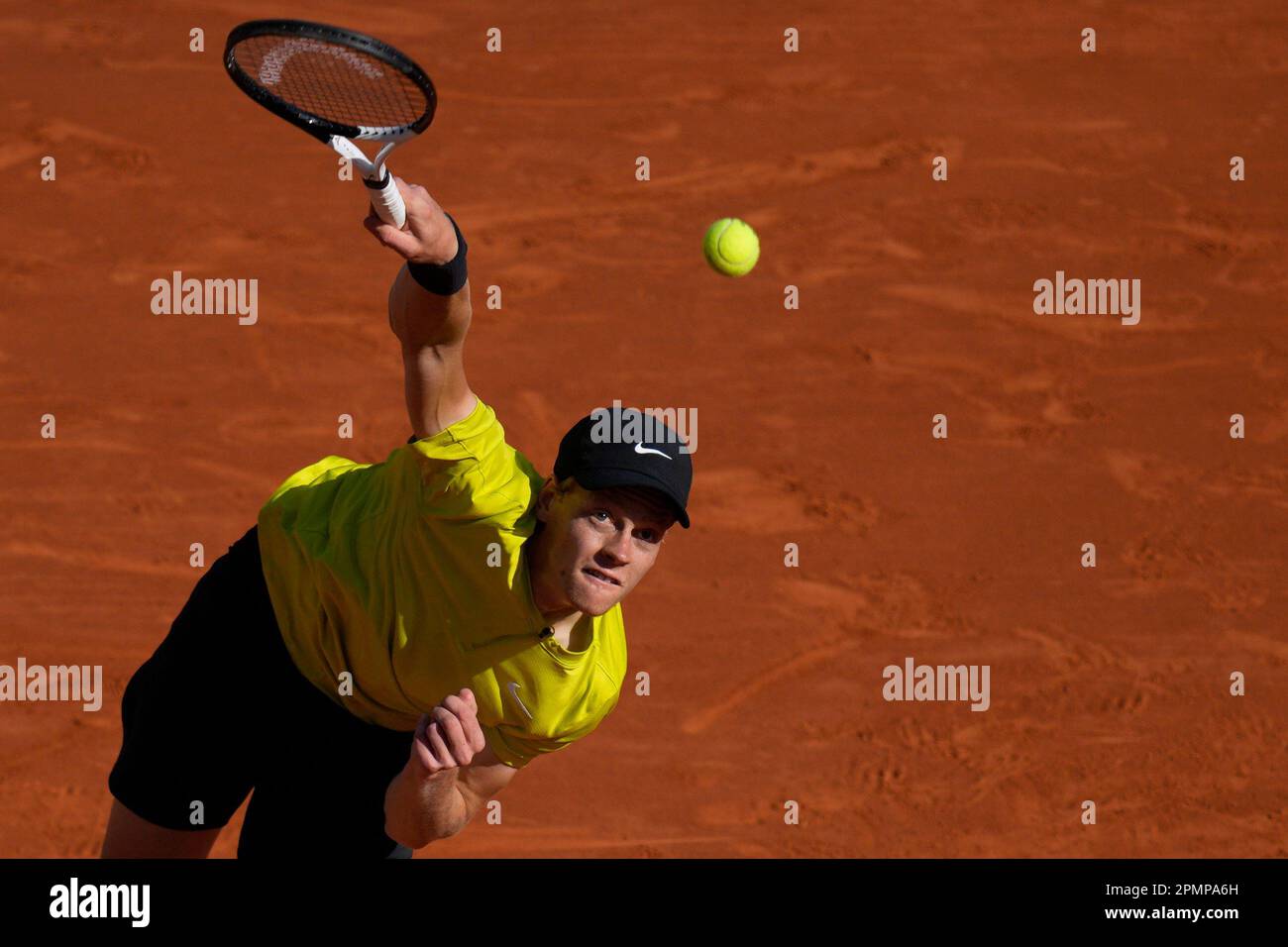 Jannik Sinner, of Italy, serves to Lorenzo Musetti, also of Italy ...