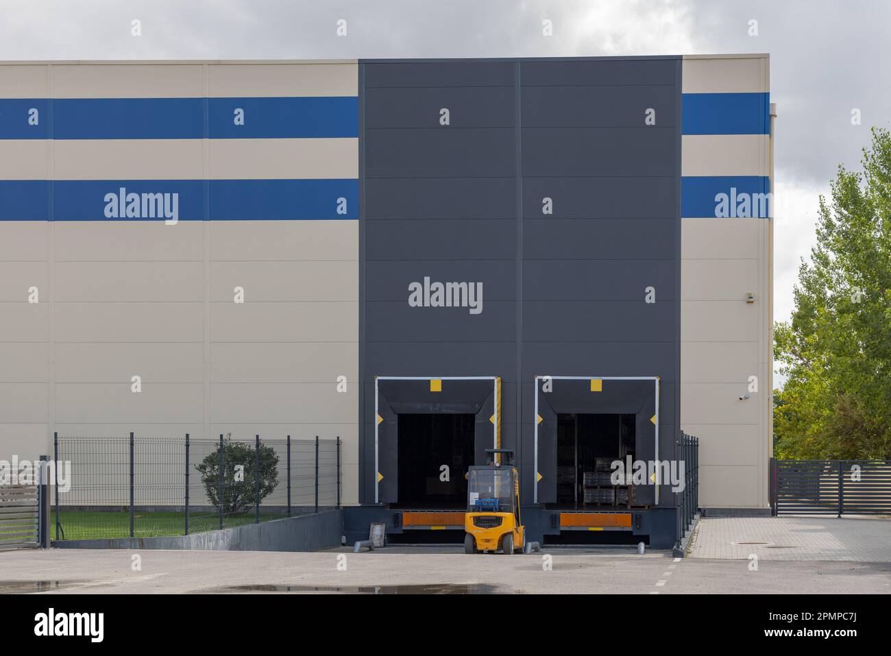 Forklift in Front of Loading Cargo Doors Distribution Warehouse ...