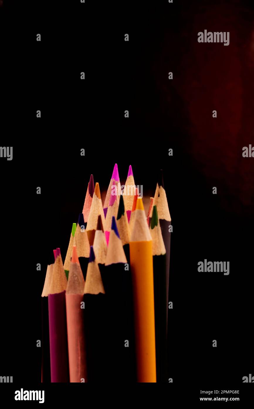 Dynamic close up still life of art coloured pencils grouped together in ...