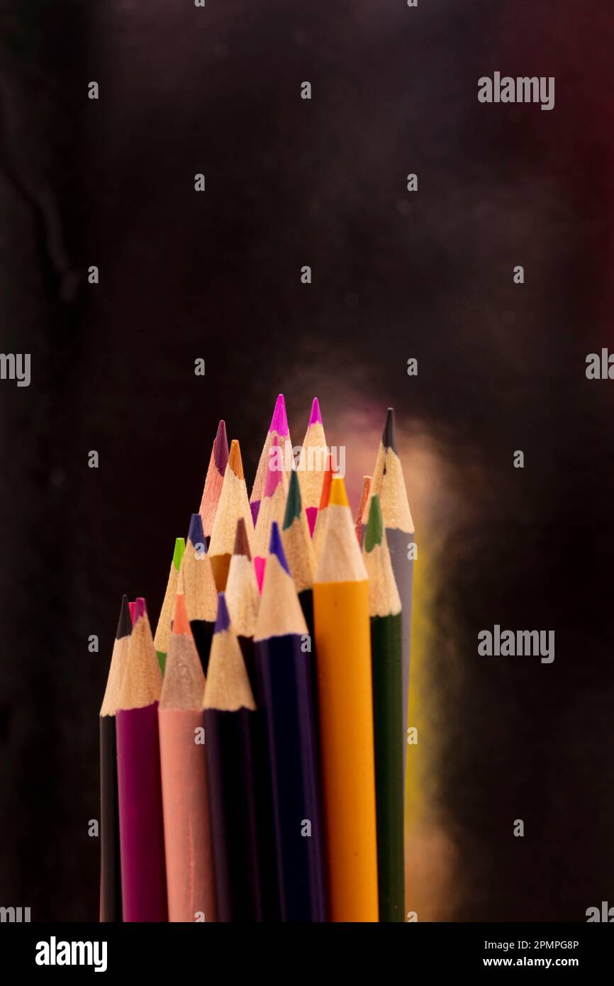 Dynamic close up still life of art coloured pencils grouped together in ...