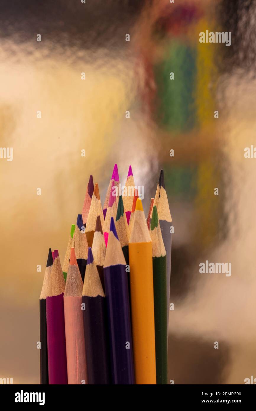 Dynamic close up still life of art coloured pencils grouped together in ...