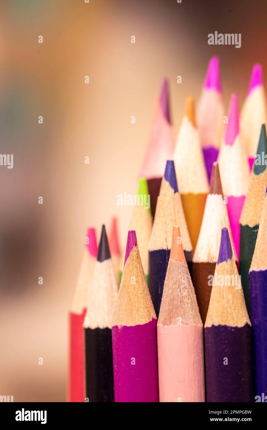 Dynamic close up still life of art coloured pencils grouped together in ...