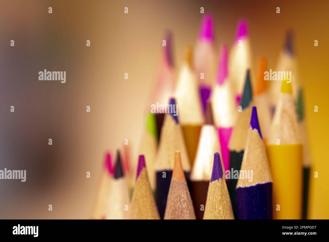 Dynamic close up still life of art coloured pencils grouped together in ...
