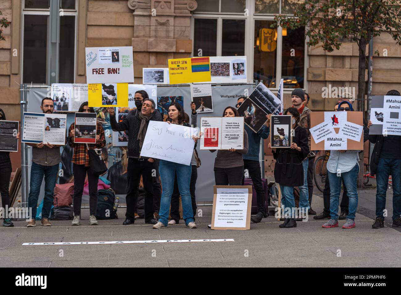 Group of people with signs protesting against oppression of women in ...