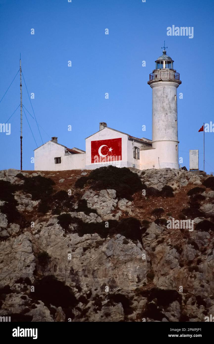 Lighthouse and building with a Turkish flag and antennas; Knidos ...
