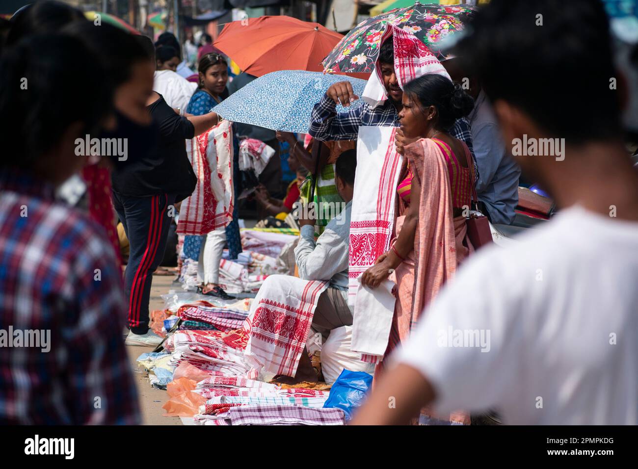 Street vendor selling Assamese traditional Gamosa during Rongali Bihu ...