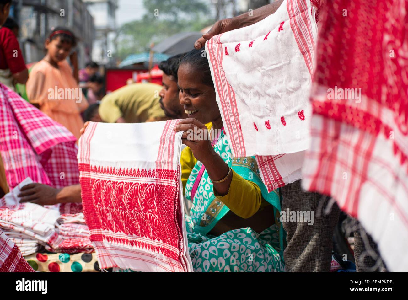 Street vendor selling Assamese traditional Gamosa during Rongali Bihu ...