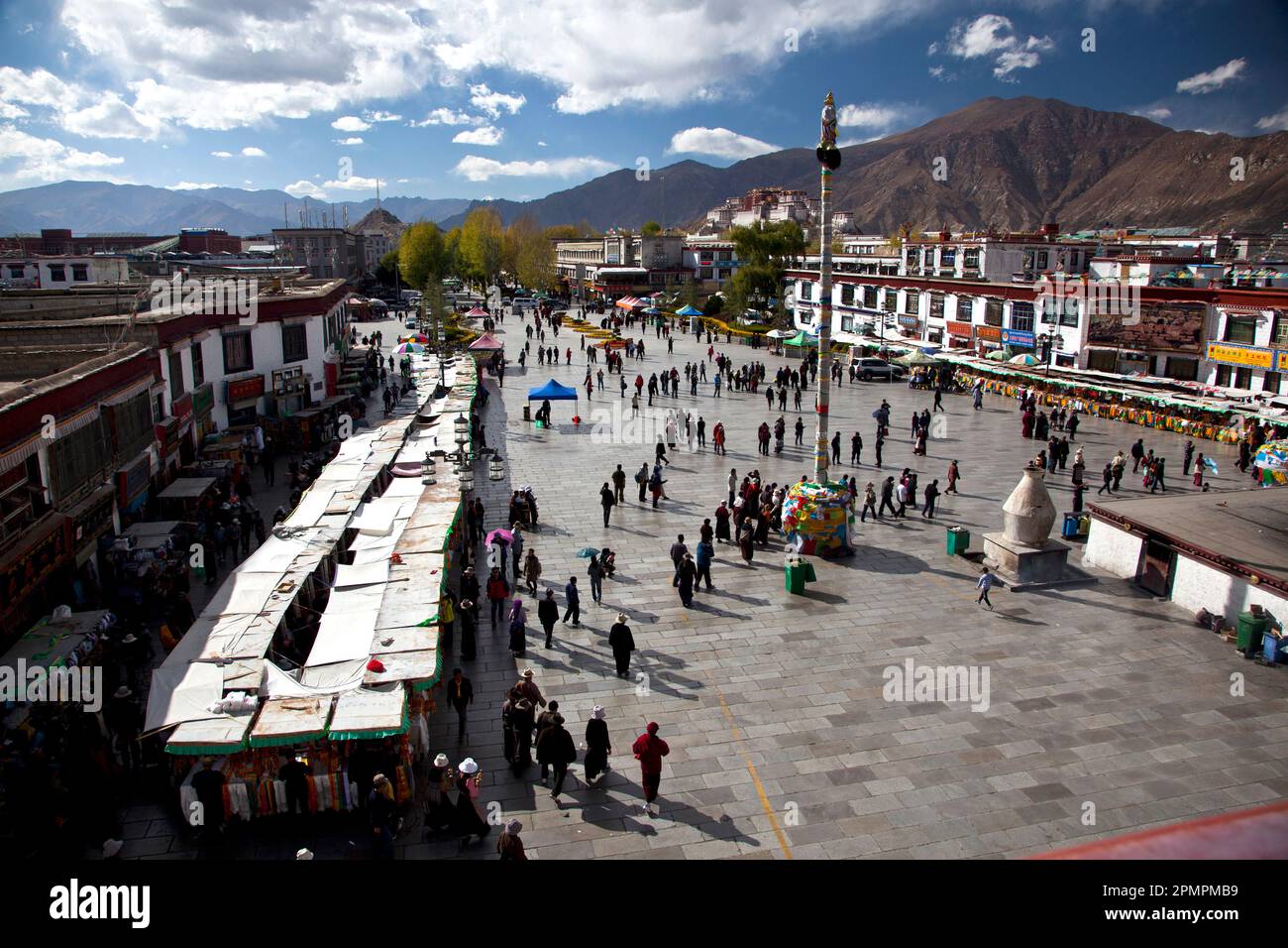 Borkhar market, with Potala Palace in the background Stock Photo - Alamy
