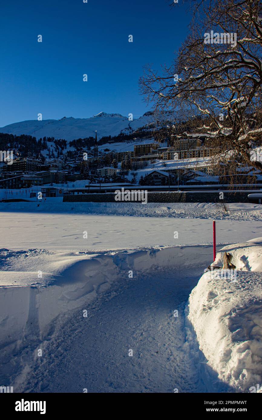 Magnificent sunset in the snowy Swiss Alps overlooking the city of St ...