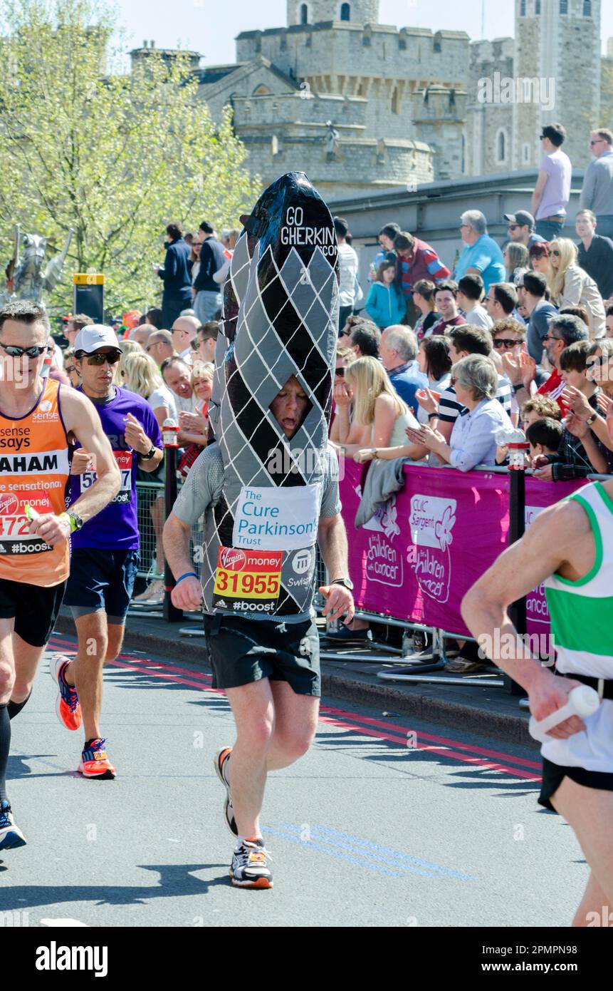Man wearing a Gherkin skyscraper costume competing in the London ...