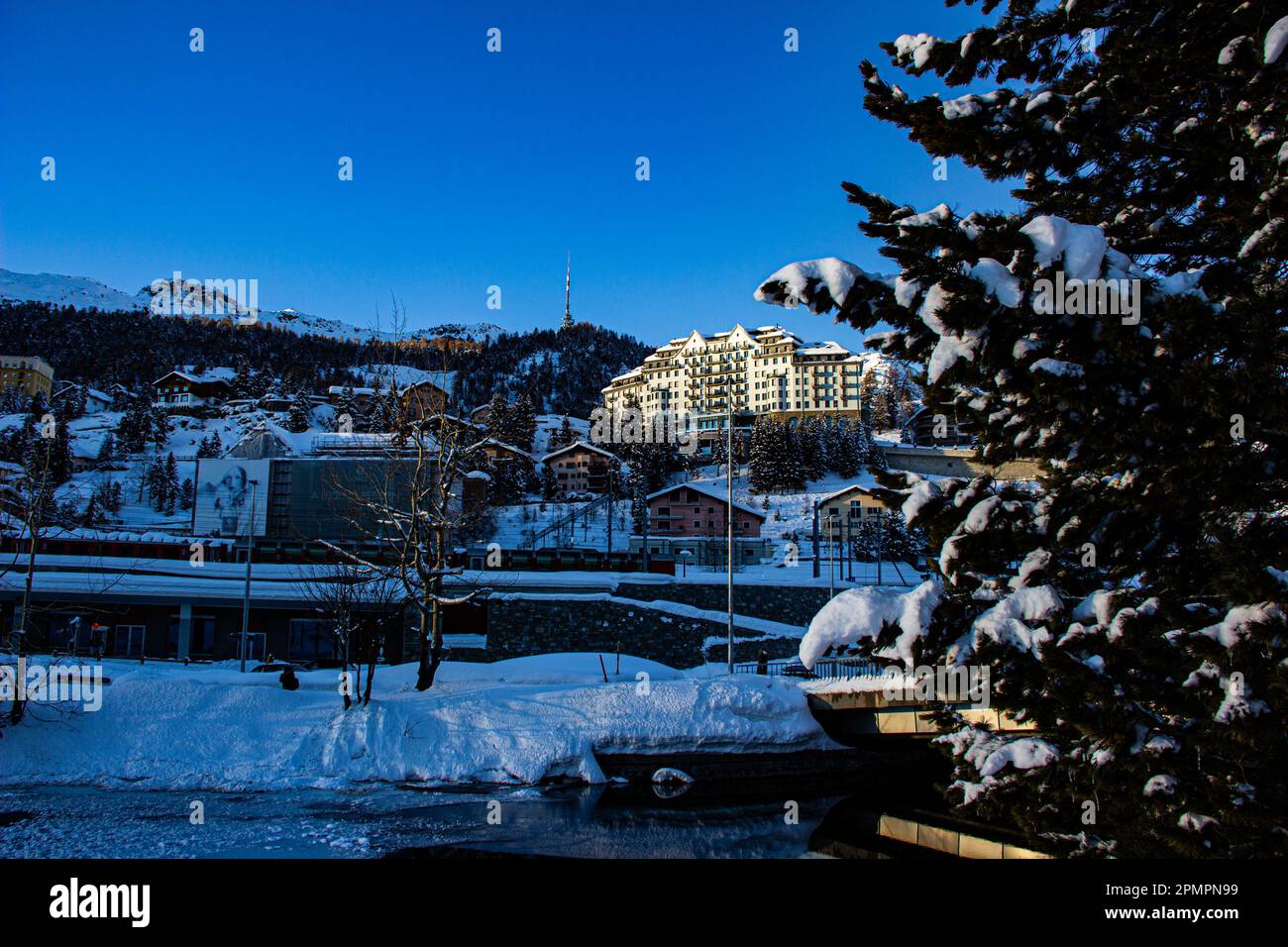 Magnificent sunset in the snowy Swiss Alps overlooking the city of St ...
