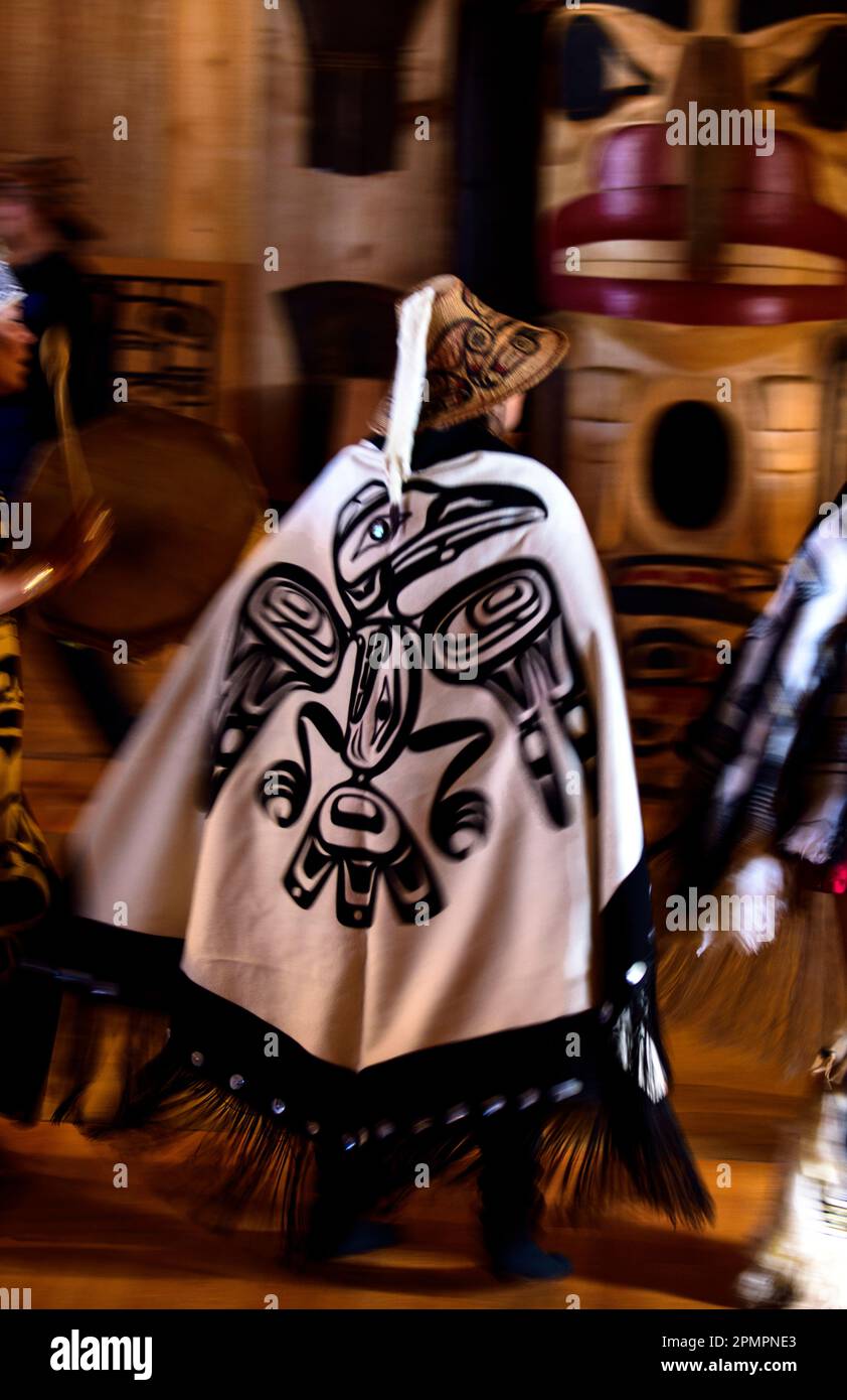 Dancer dressed as a totem spirit performing traditional Haida dance at ...