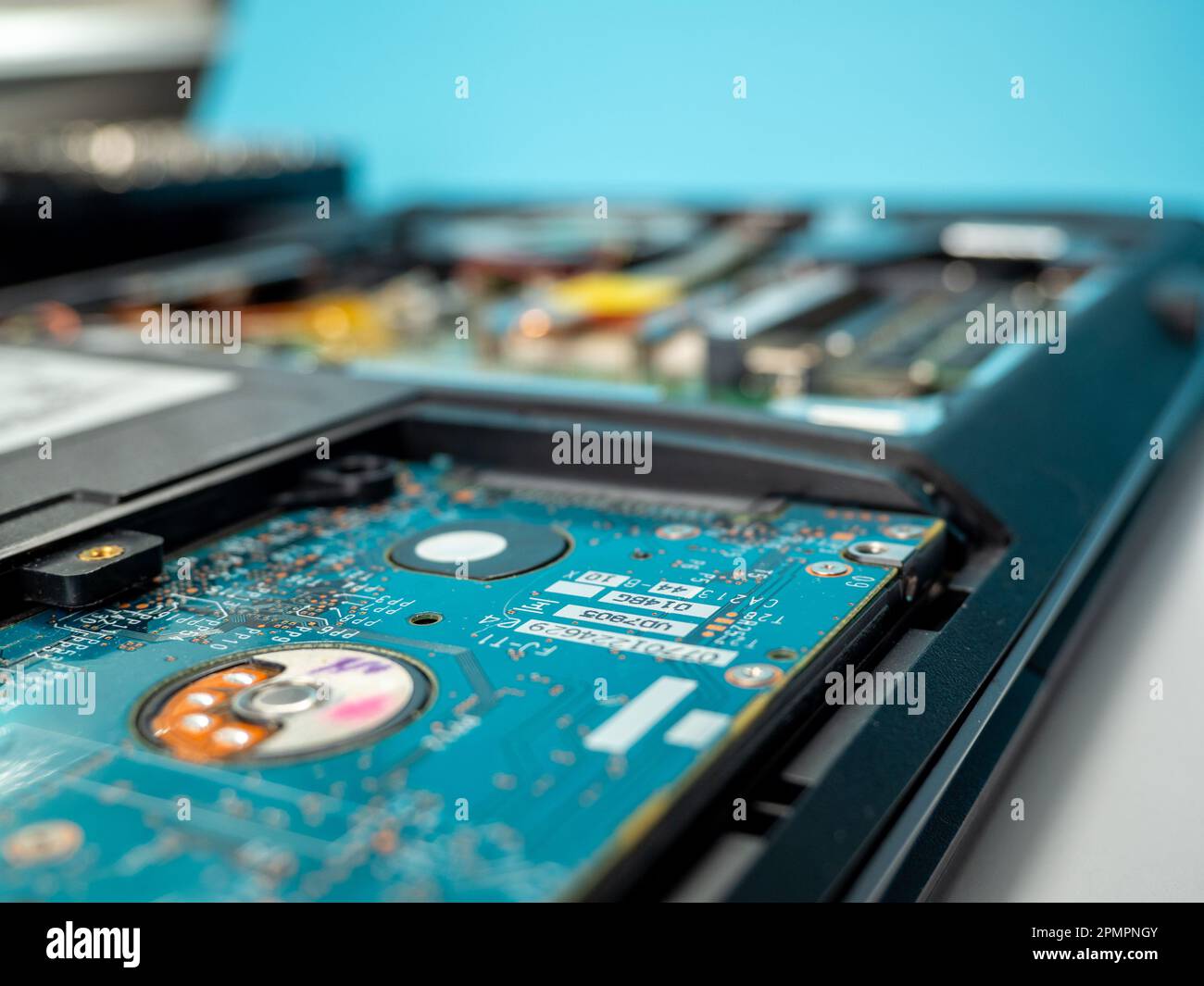 Electronic board of an old broken laptop. Dusty broken laptop under ...