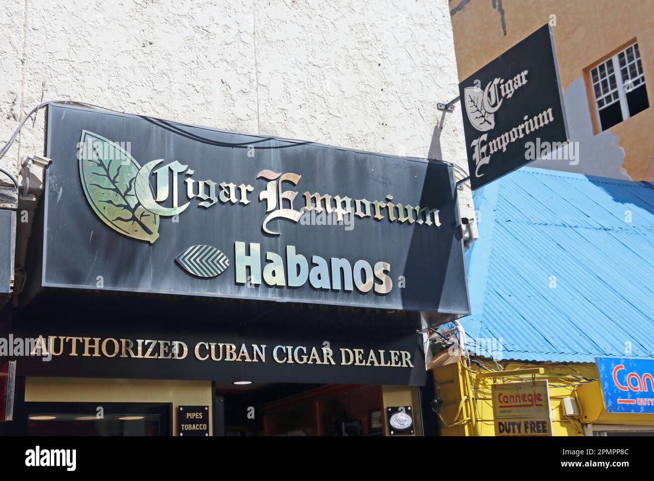Cigar Sign over Emporium, Philipsberg, St Maarten Stock Photo - Alamy