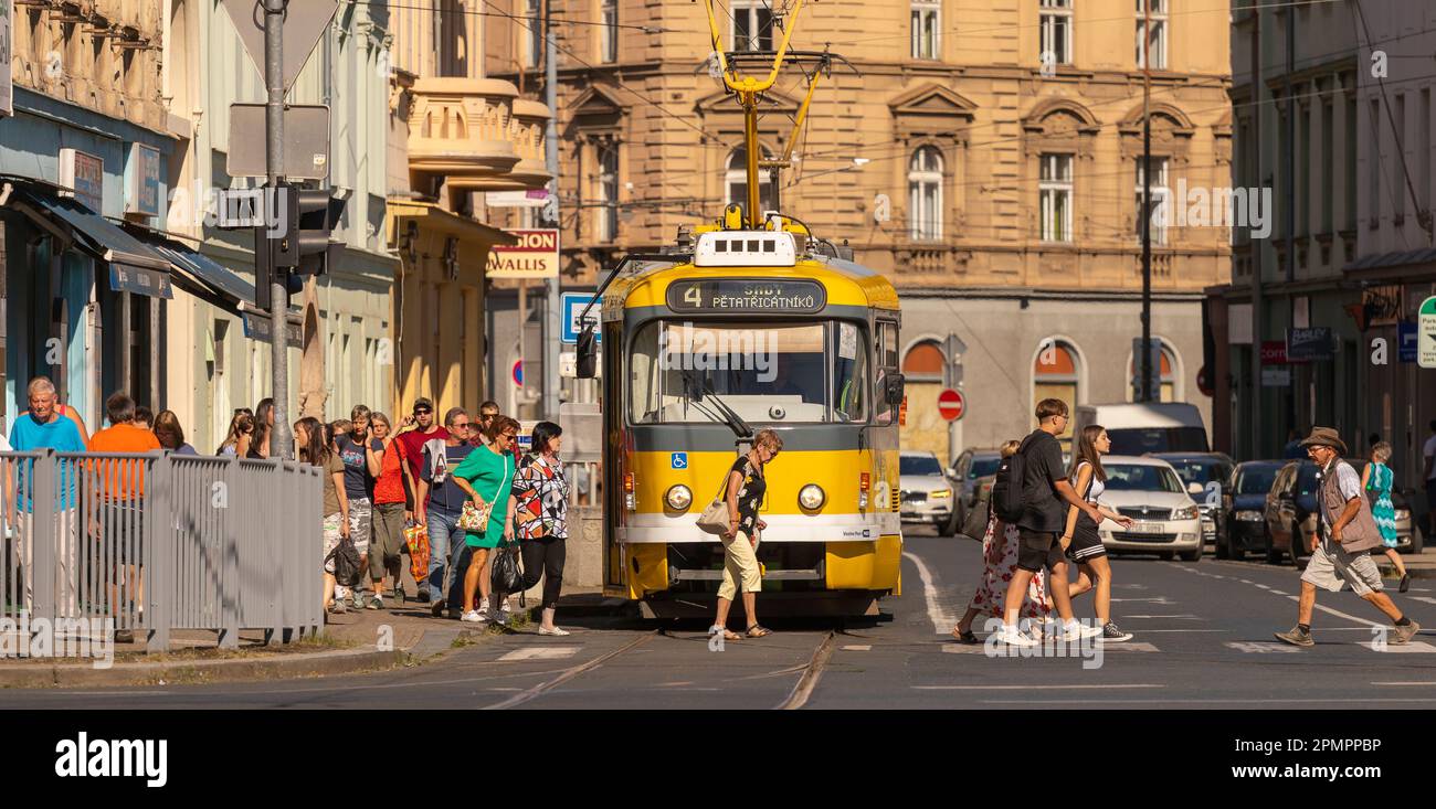 PILSEN, CZECH REPUBLIC, EUROPE - Tram streetcar and people crossing ...