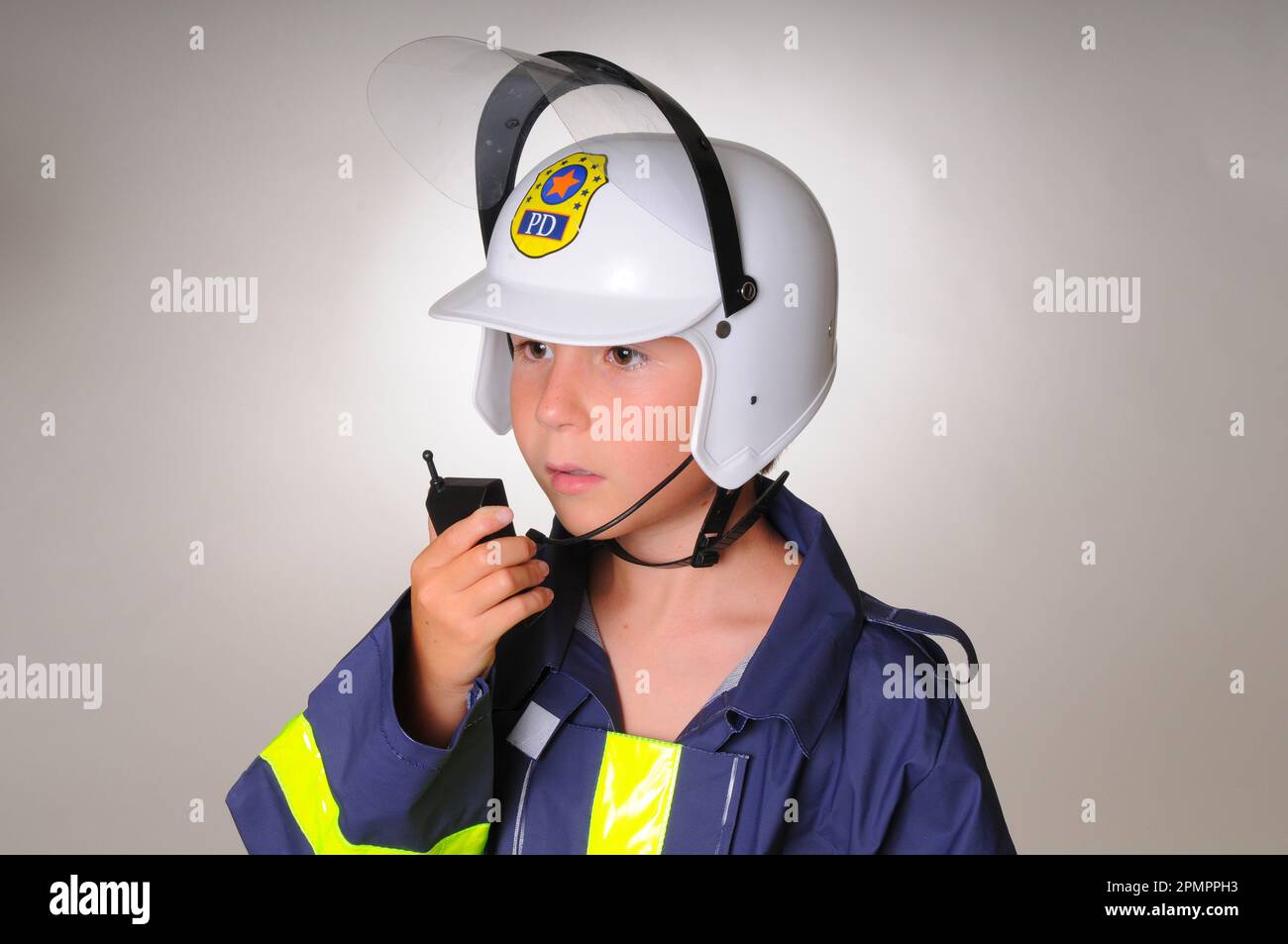 A Young boy wearing a policeman's costume Stock Photo - Alamy