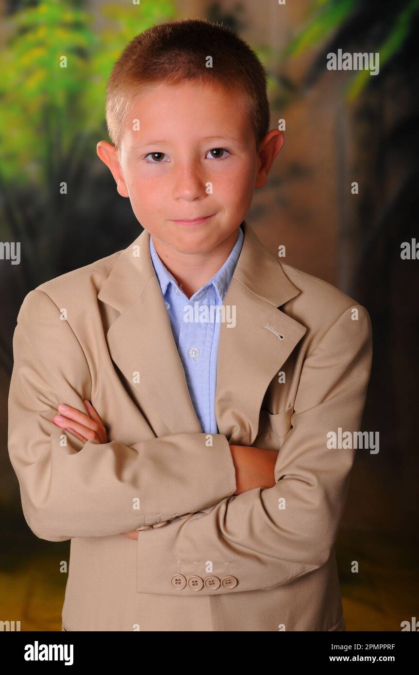 Young boy businessman dressed formally wearing a suit Stock Photo - Alamy