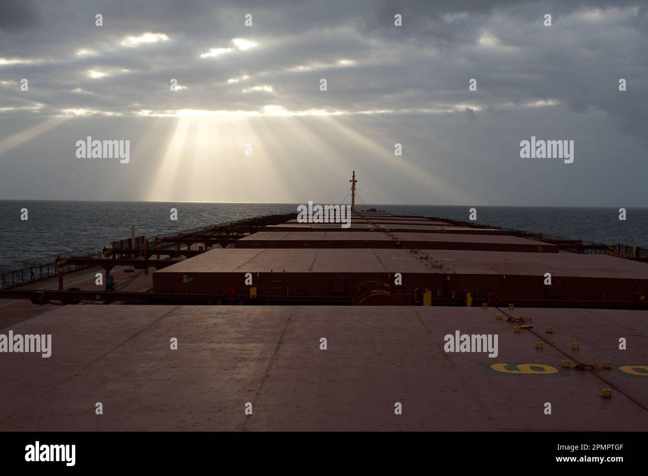 Merchant ship carrying bulk cargo is underway at sea in the morning ...