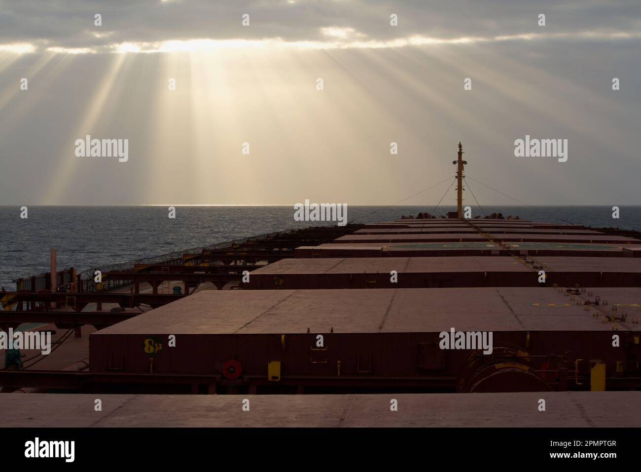Merchant ship carrying bulk cargo is underway at sea in the morning ...