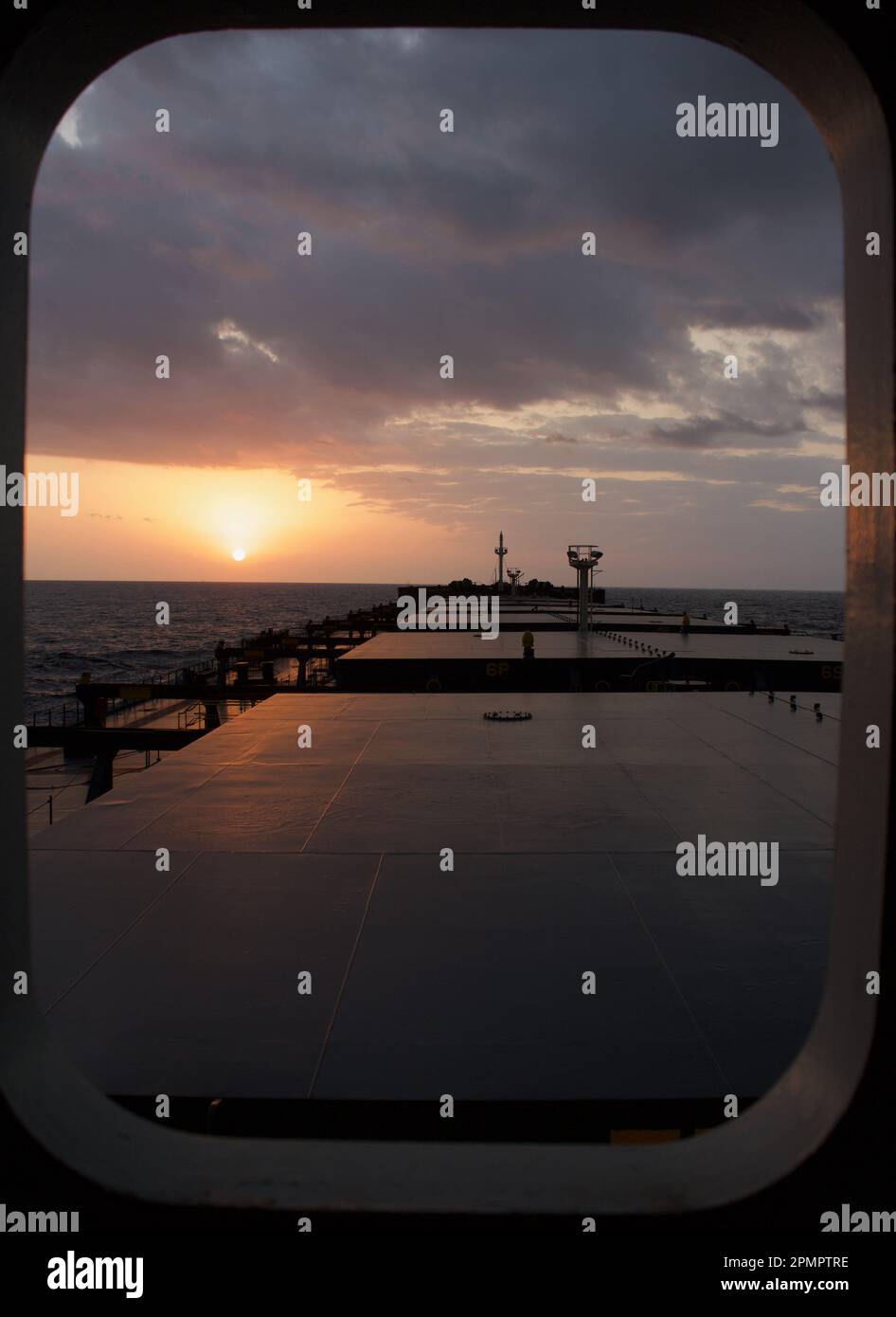 Beautiful view through the window of a merchant ship carrying bulk ...