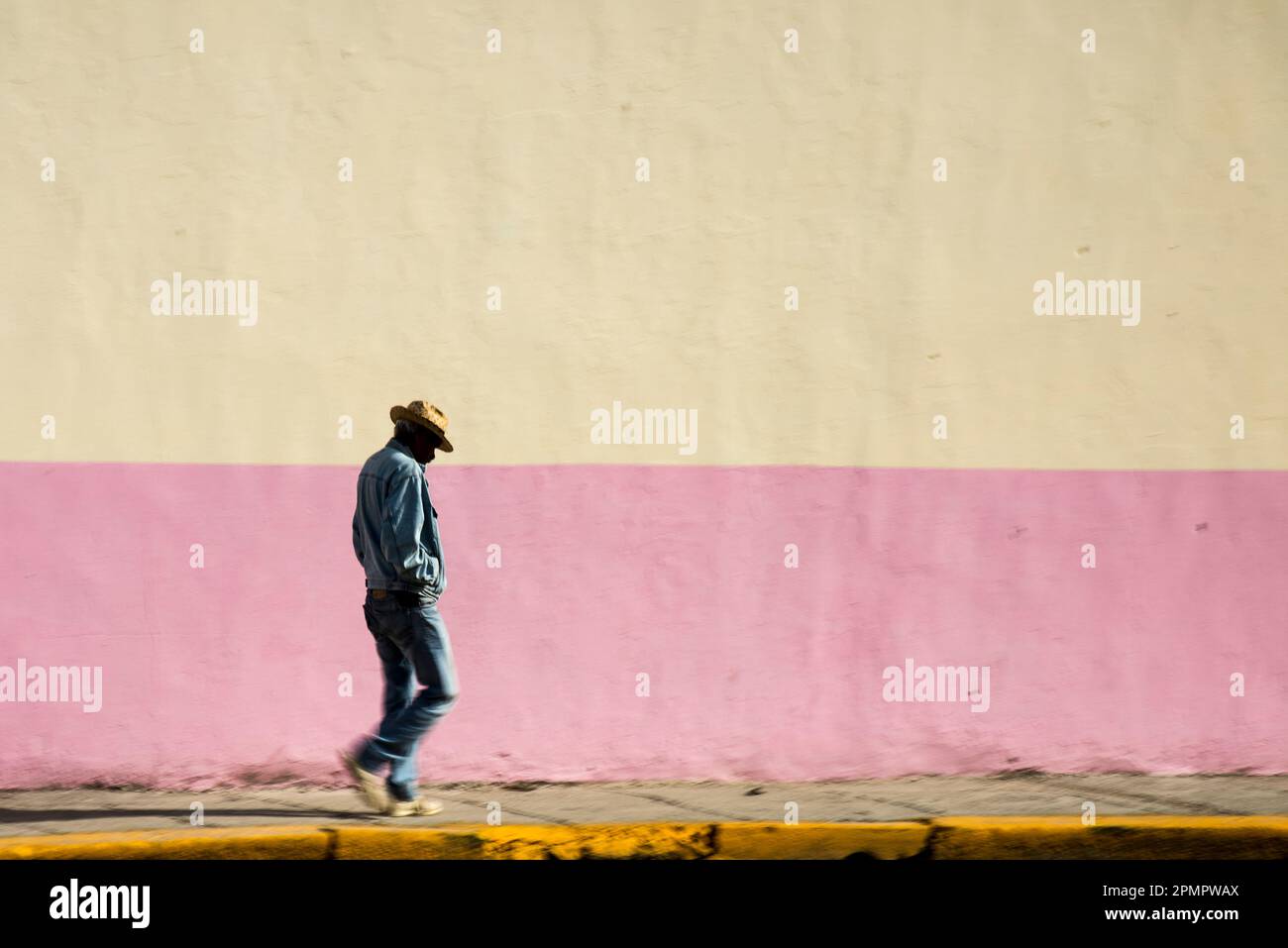 Pedestrian walks on a sidewalk in Havana, Cuba; Havana, Cuba Stock ...