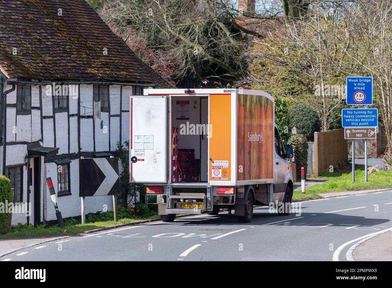 A Sainsbury's delivery van delivering groceries to a house in Sonning ...