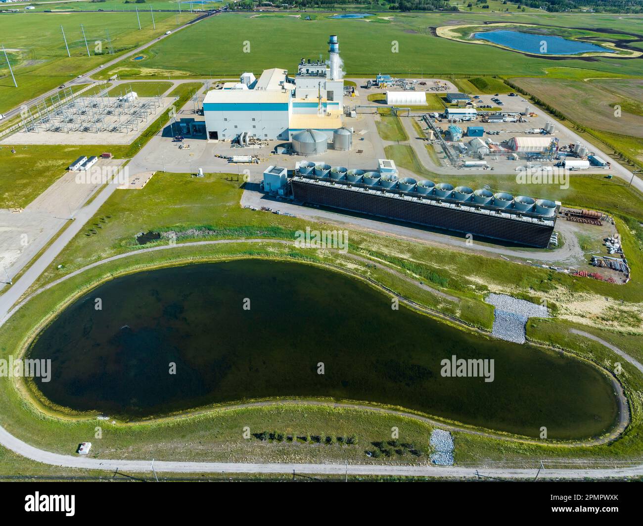 Aerial view of an electrical generating plant with cooling tower in the ...