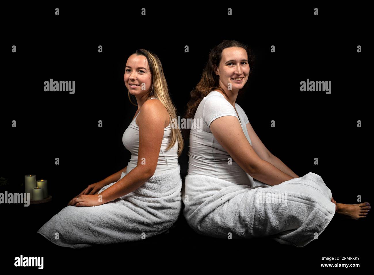 women and energy healing in front of black background Stock Photo - Alamy