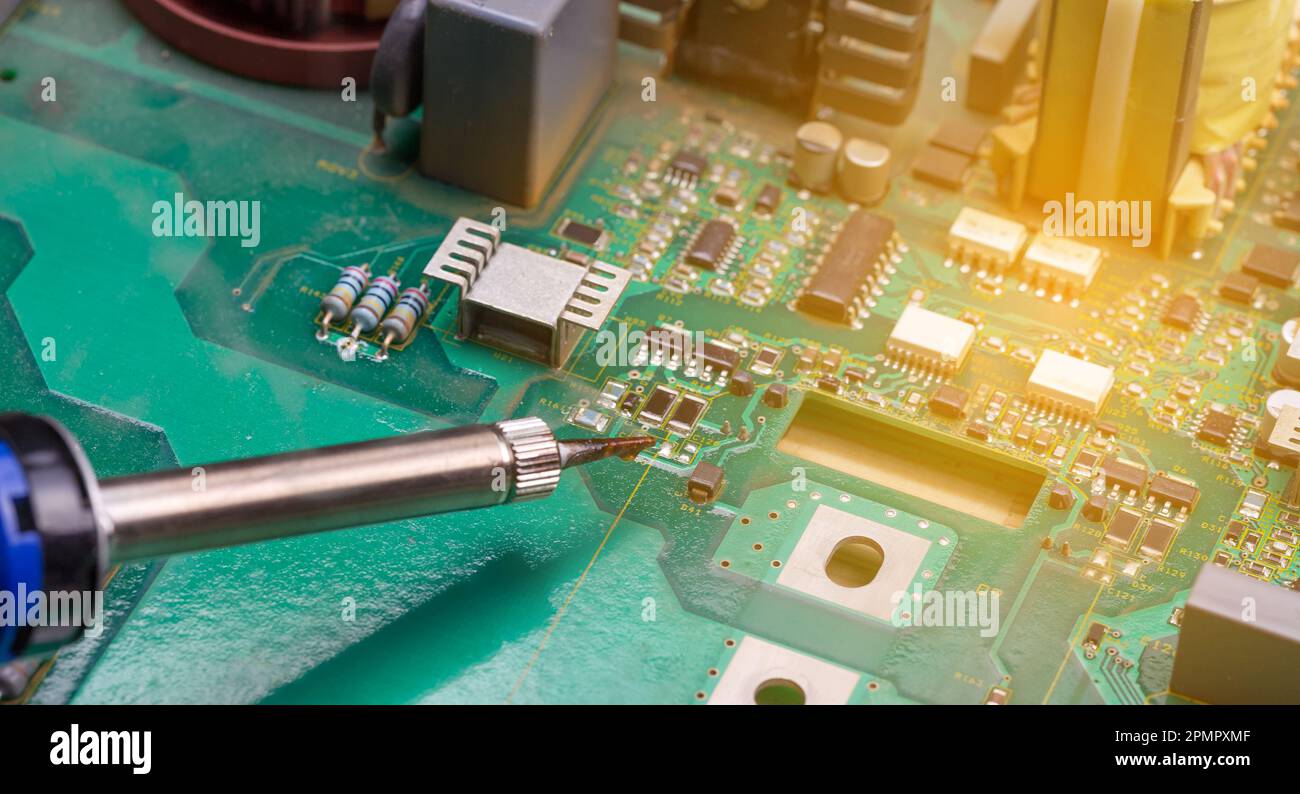 Soldering iron. Repairing electronic component. Microelectronics ...