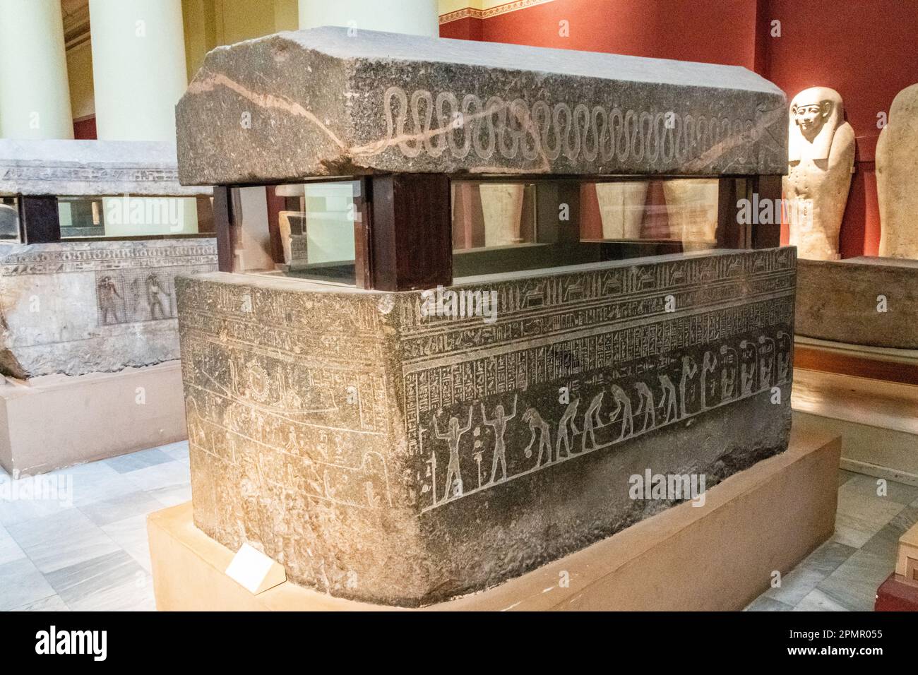 A stone sarcophagus with carvings displayed at the Museum of Egyptian Antiquities in Cairo ...