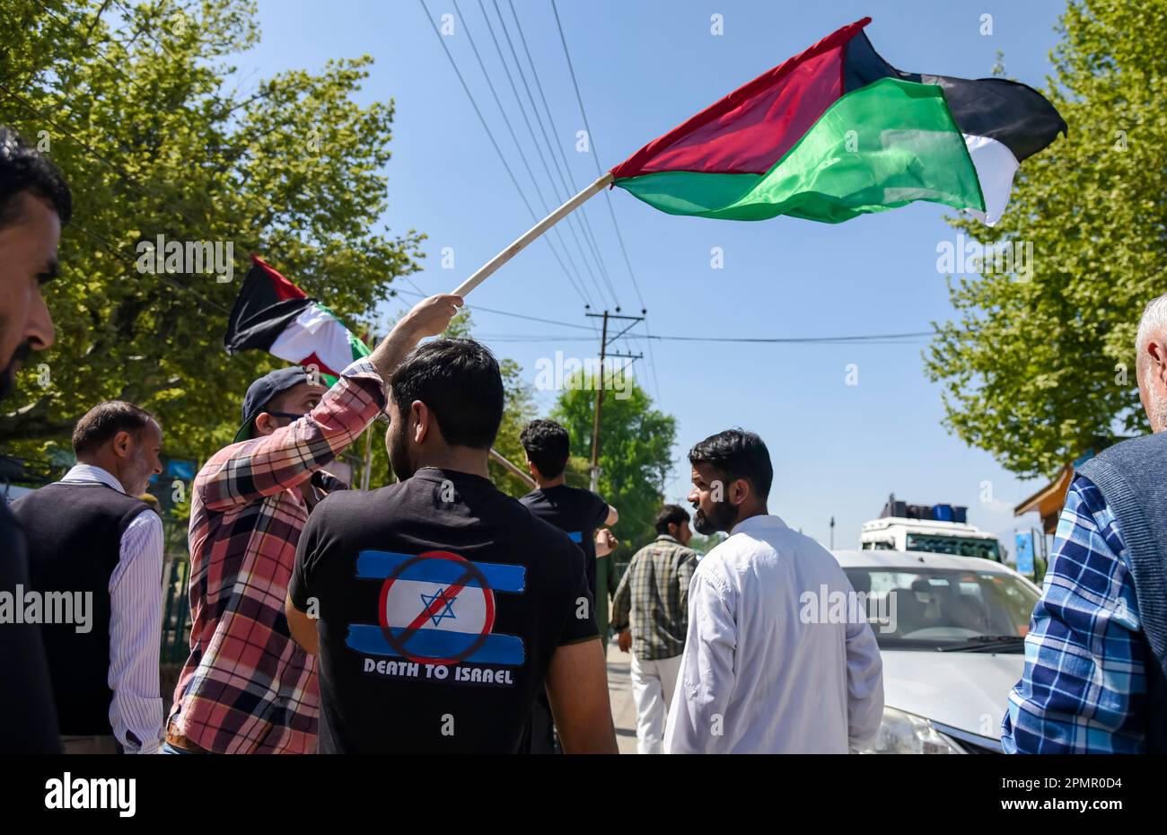 Srinagar, India. 14th Apr, 2023. A Kashmiri Muslim wave a Palestinian ...