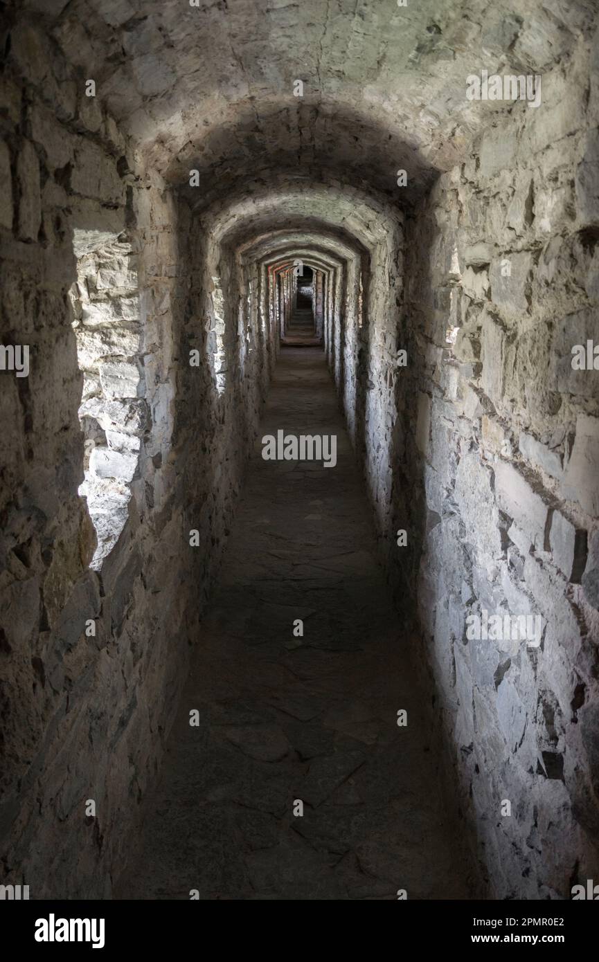 Stone Tunnels. Narrow balcony corridor with brick walls in the castle Stock Photo - Alamy