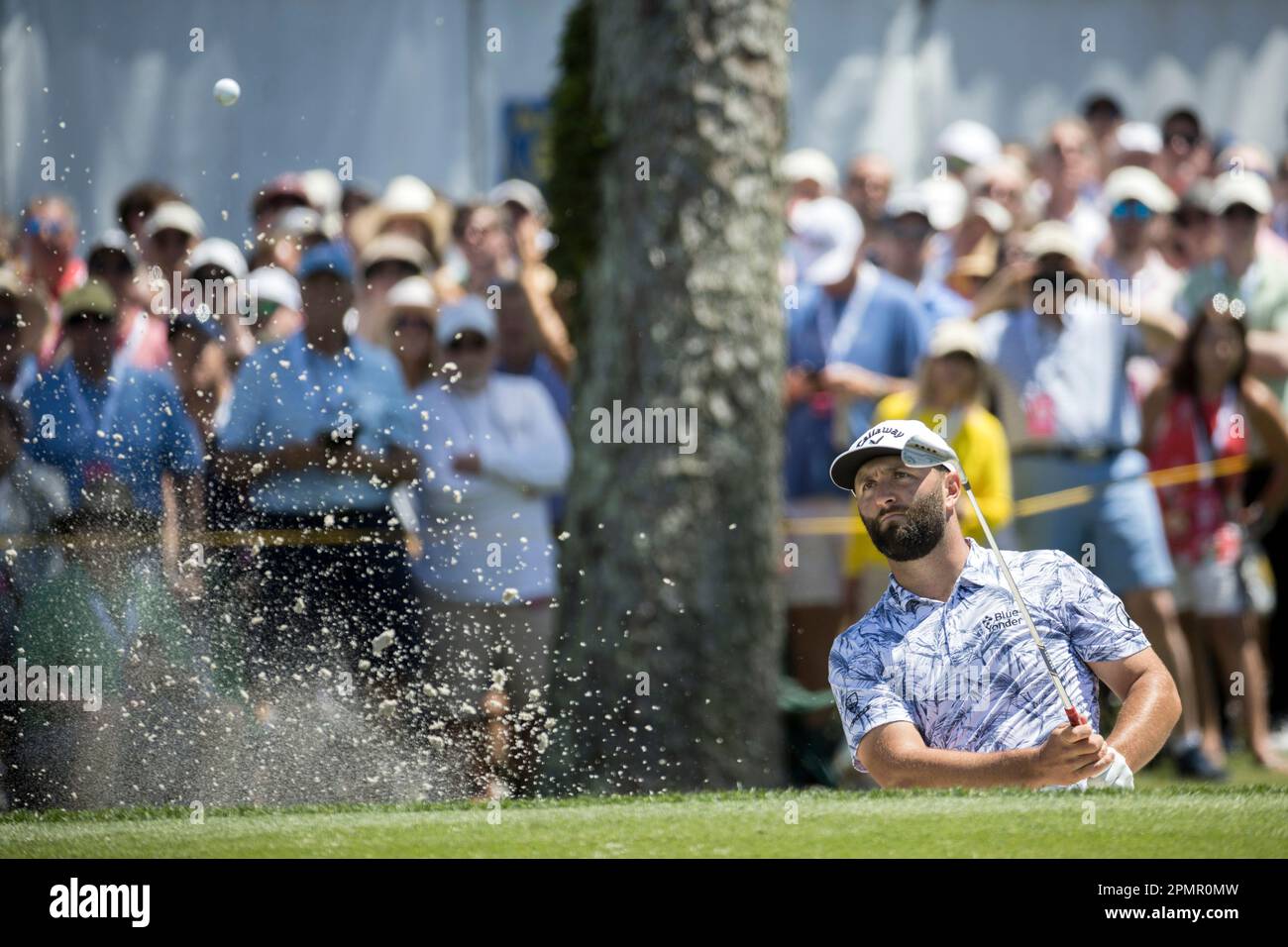 Jon Rahm, of Spain, hits out of a bunker on the ninth green during the ...