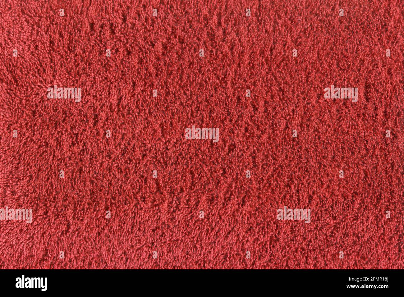 texture of red terry cloth fabric. close up of a towel terry cloth ...