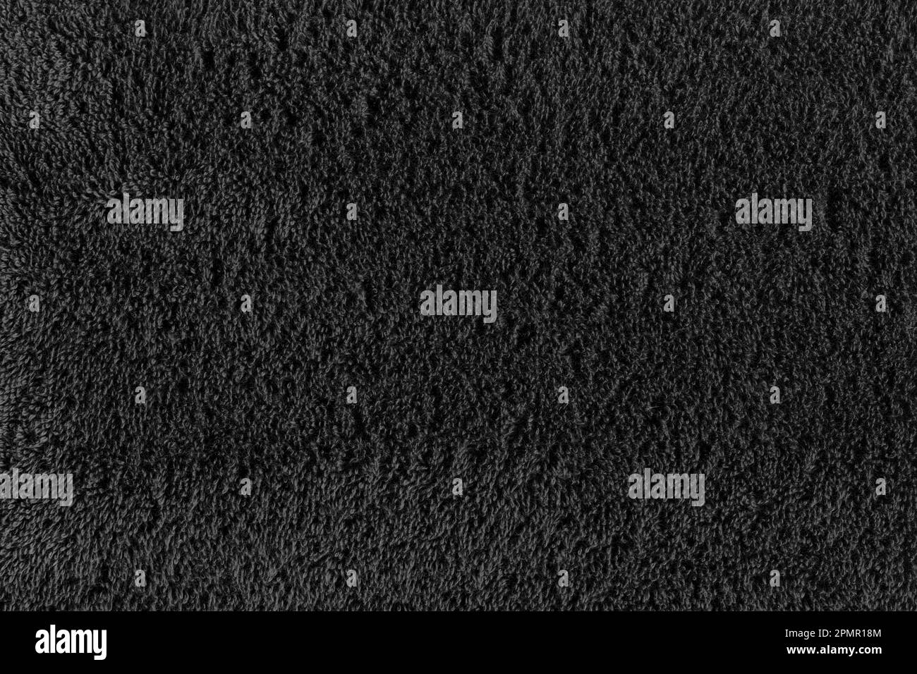 texture of dark gray terry cloth fabric. close up of a towel terry ...