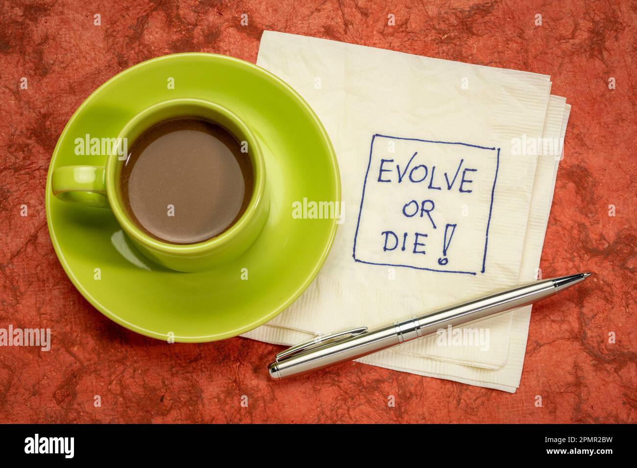 Evolve or die napkin doodle with a cup of coffee, lifestyle and ...