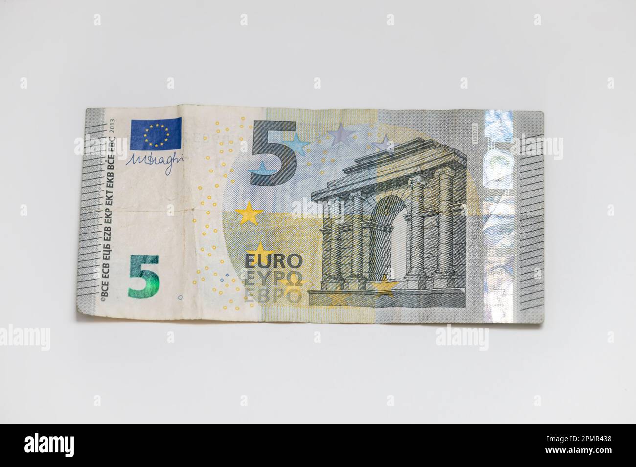 April 14, 2023 Amsterdam Netherlands. 5 euro banknote on a white ...