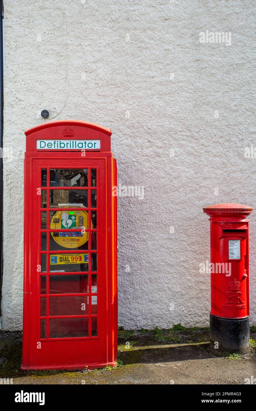 Red royal mail post box and red telephone box now used to house a ...