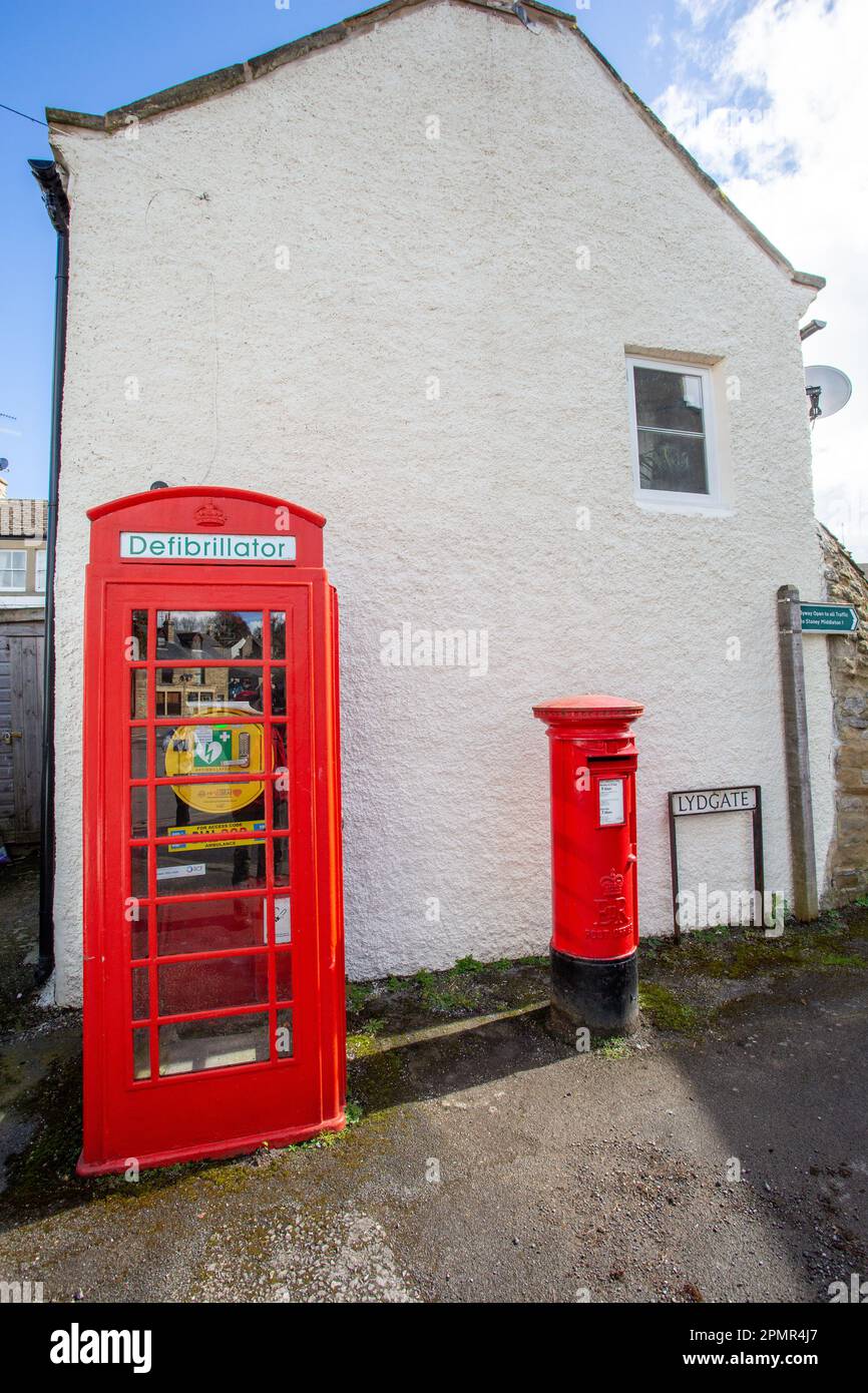 Red royal mail post box and red telephone box now used to house a ...