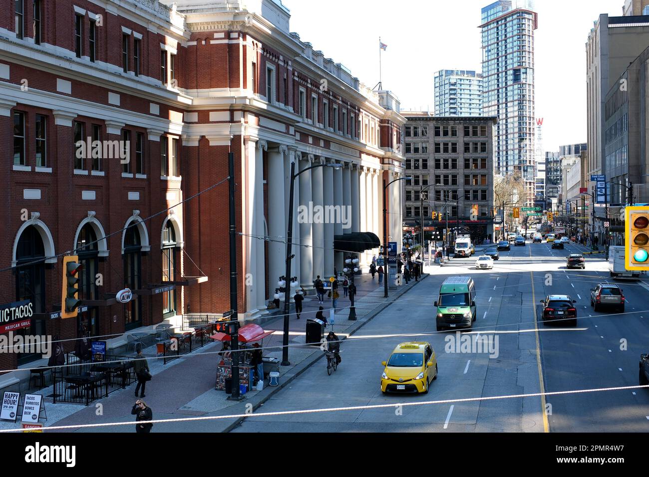 downtown Vancouver skytrain terminus Waterfront railway building people ...