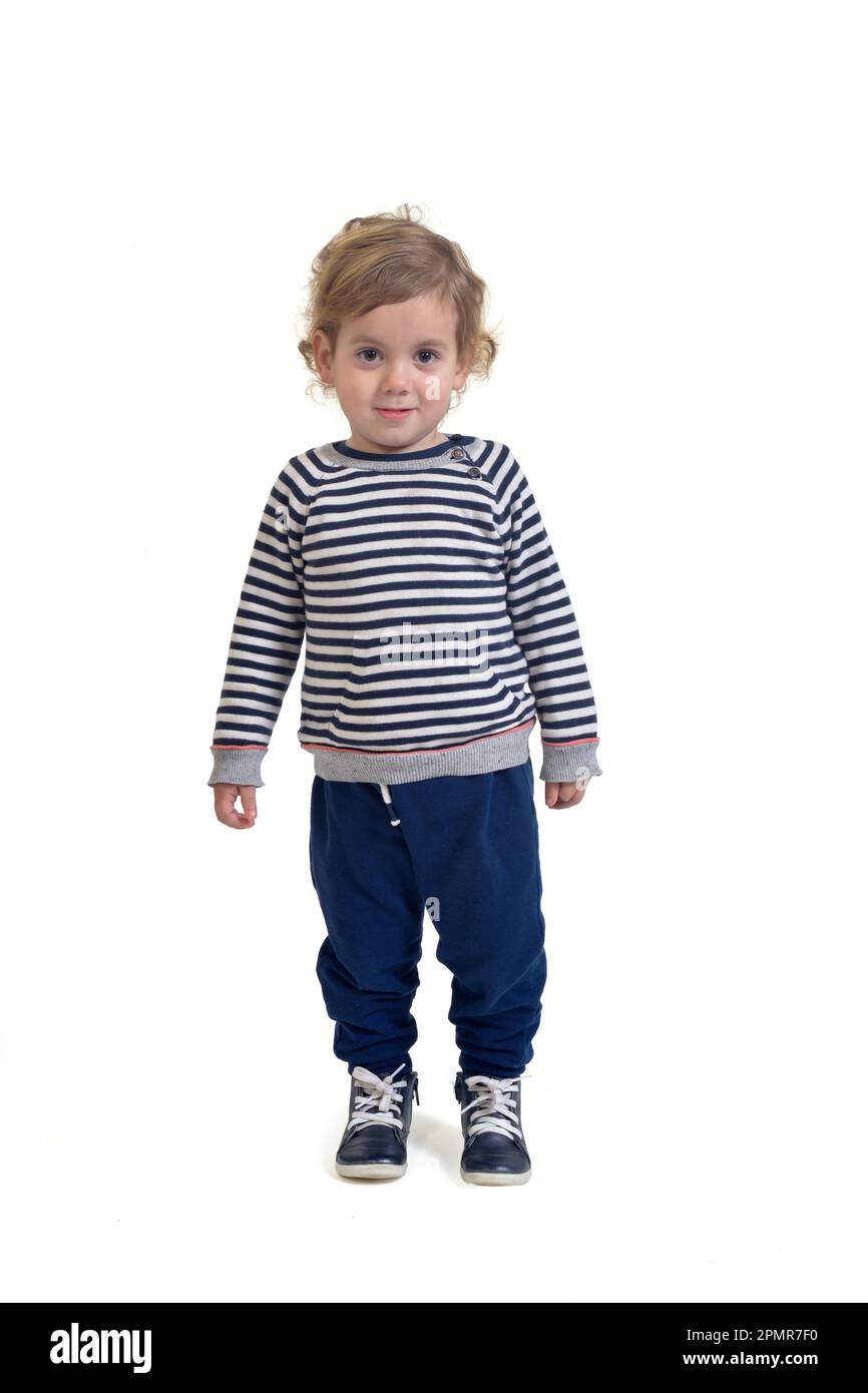 baby boy standing and looking at camera on white background Stock Photo ...