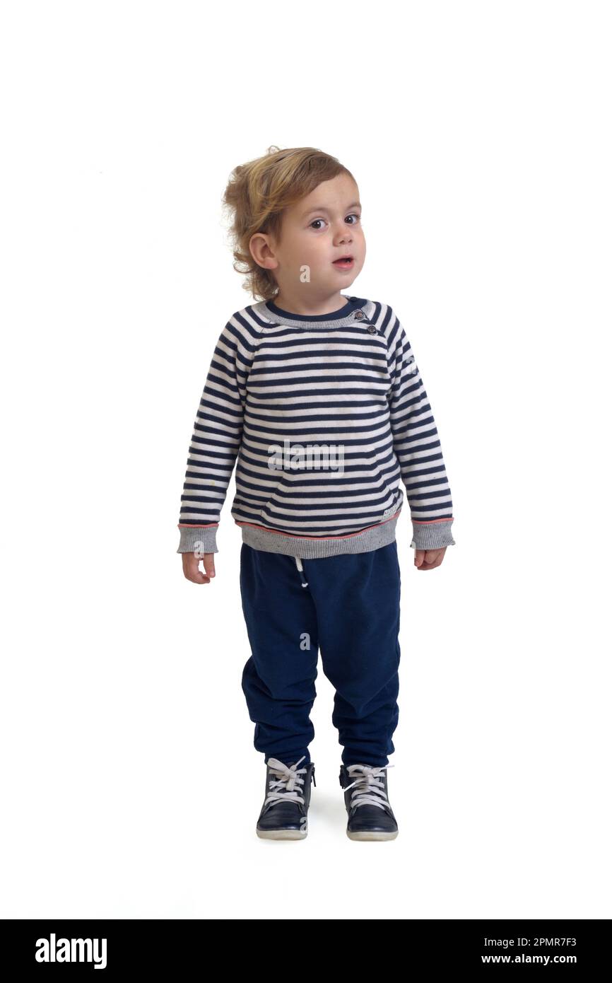 front viw of a baby boy standing and looking at camera on white ...