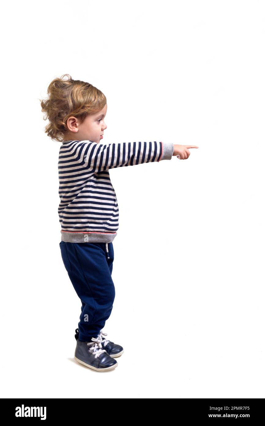 side view of a baby boy looking and pointig on white background Stock ...