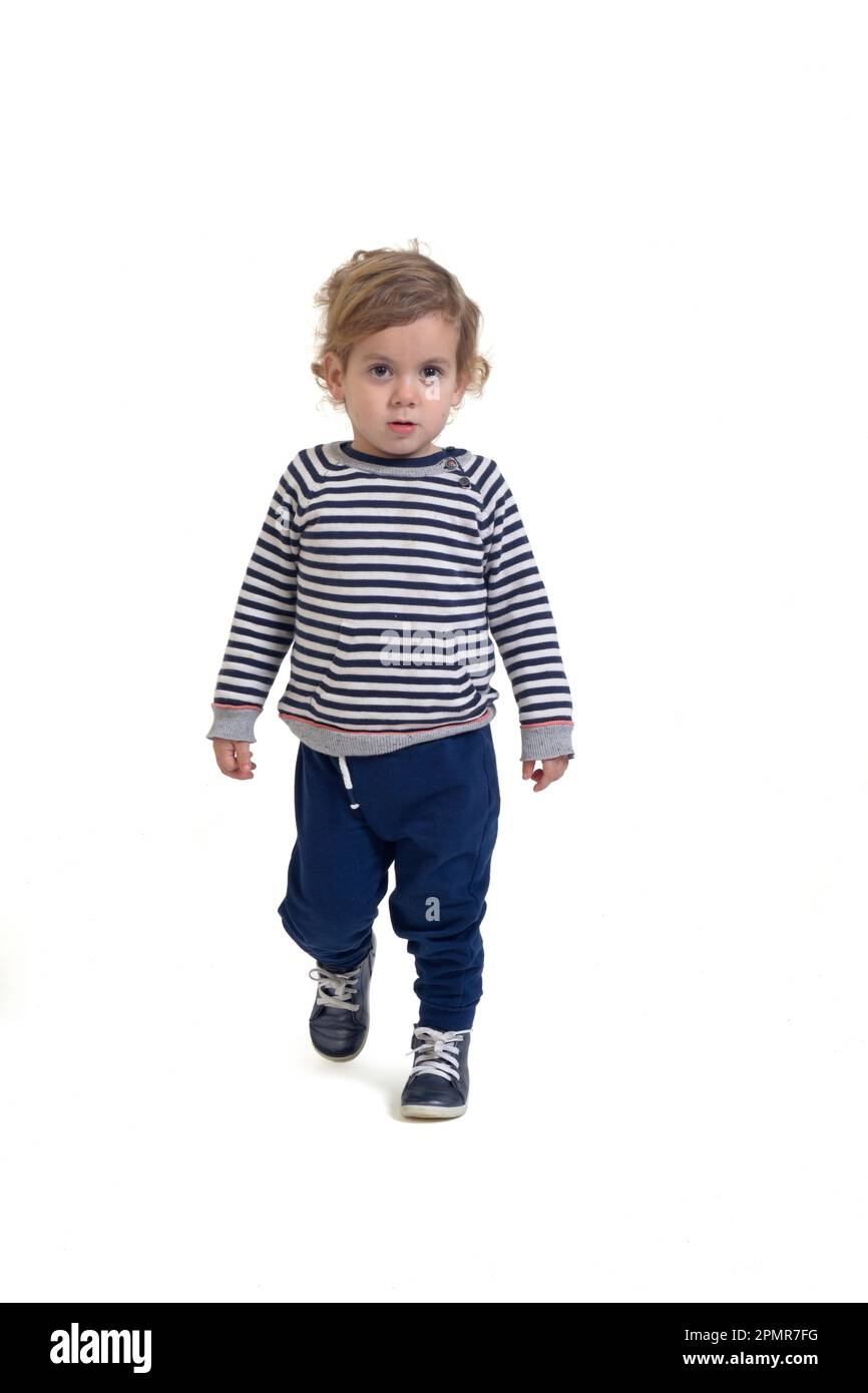front view of a baby boy walking on white background Stock Photo - Alamy