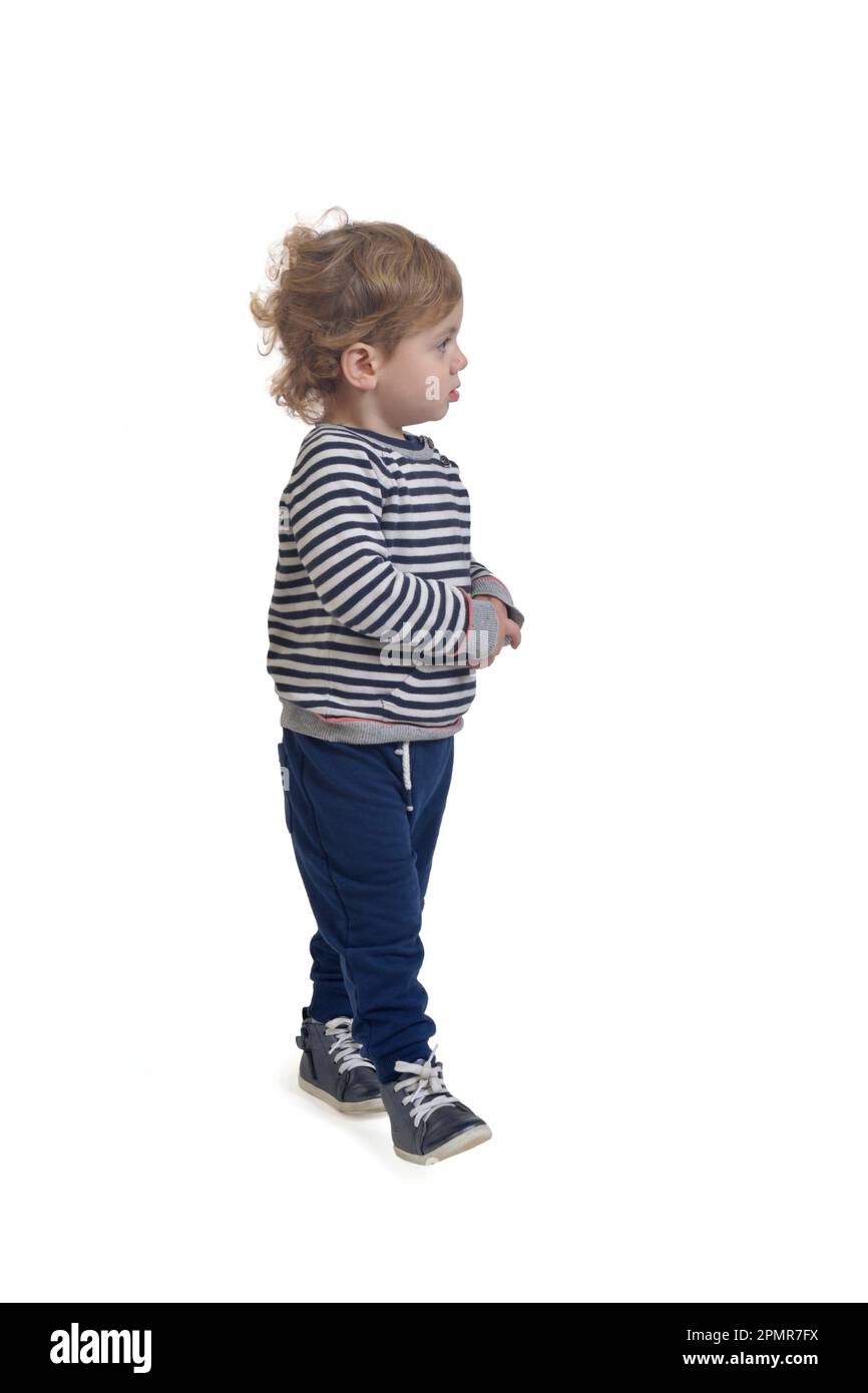 side view of a baby boy walking and looking away white background Stock ...