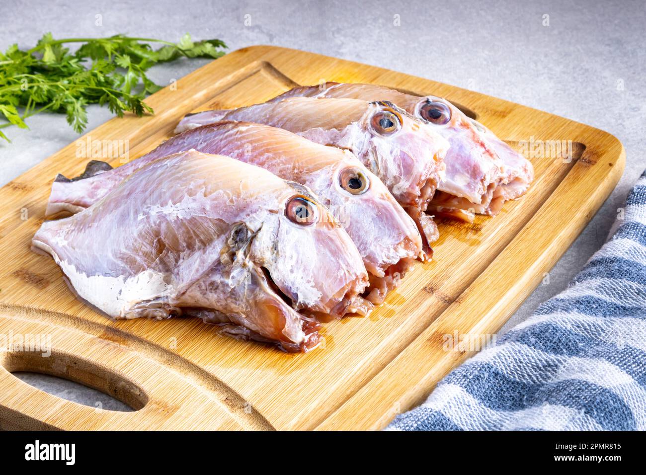 Fish "peroa" clean on the wooden board and coriander, ready to fry ...