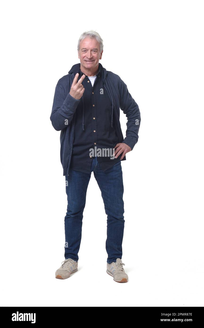 front view of a full length portrait of a man showing two finger on ...