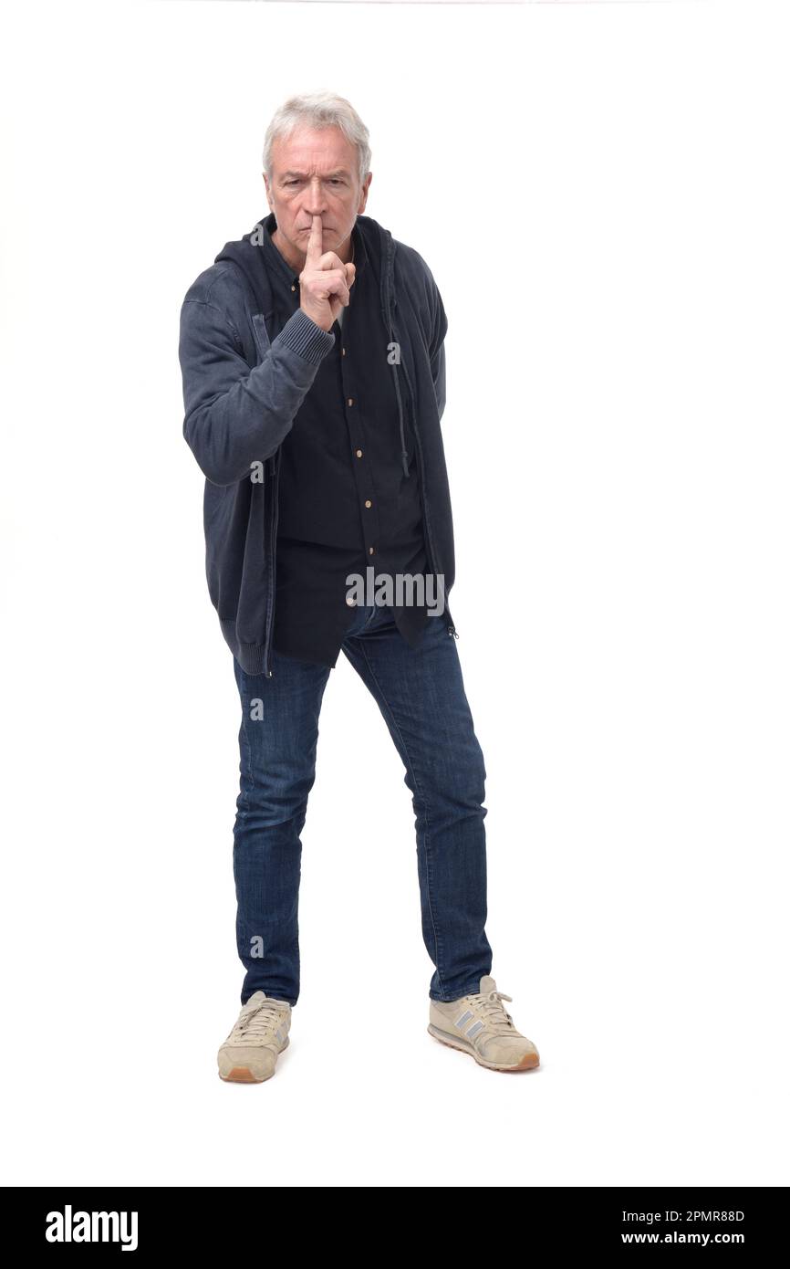 serious man showing silence sign on white background Stock Photo - Alamy