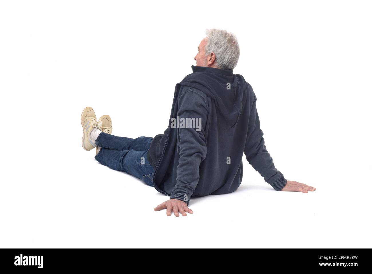 back side view of a man sitting on the floor on white background Stock ...