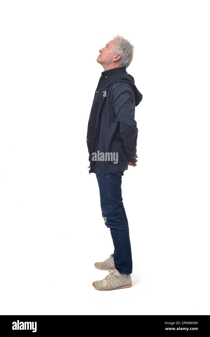 full portrait of side view of a man looking up on white background ...